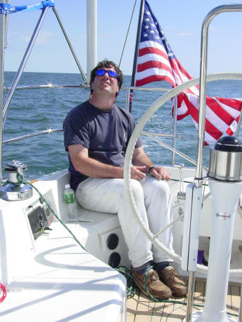 Below, Bruce gets a feel for the new boat.